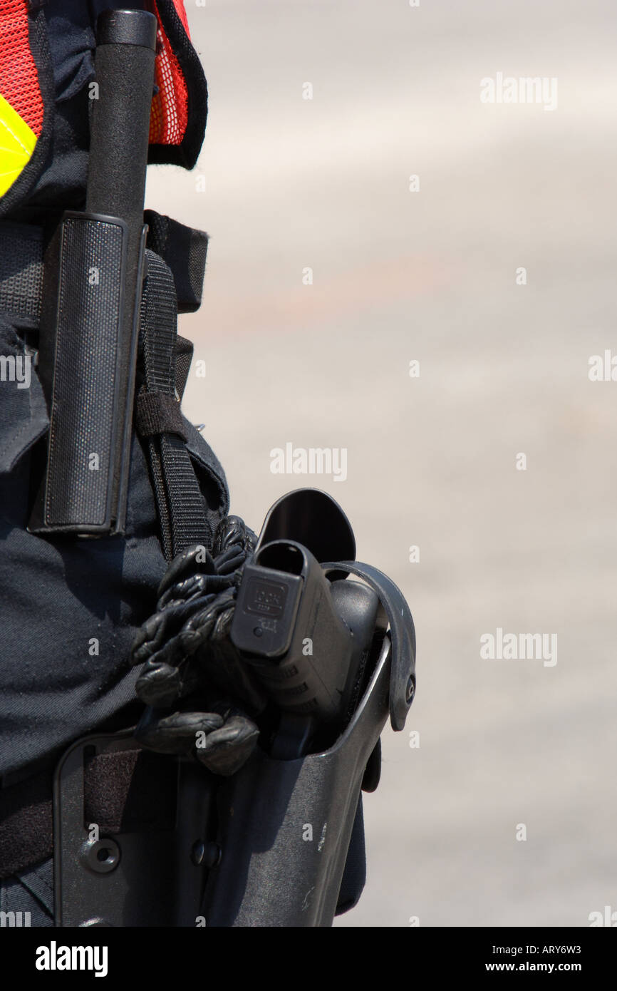 Police Officer's Glock Firearm with his telescopic baton also visible ...