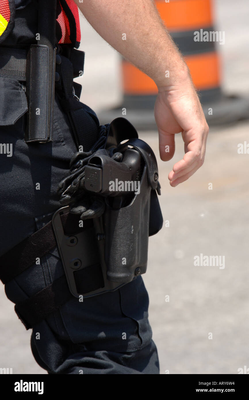 Police Officer's Glock Firearm with his telescopic baton also visible ...