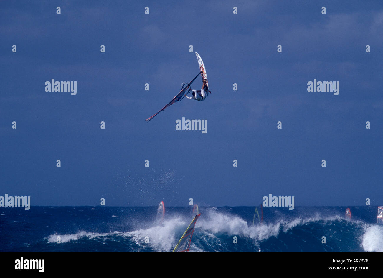 Wind surfer launches off wave. Hookipa Beach Park. Common to see some ...