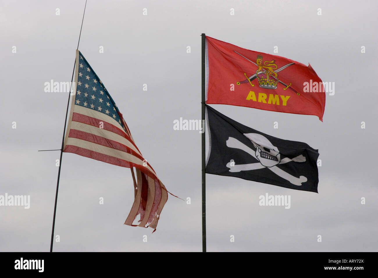 Three flags flying over military event Stock Photo - Alamy