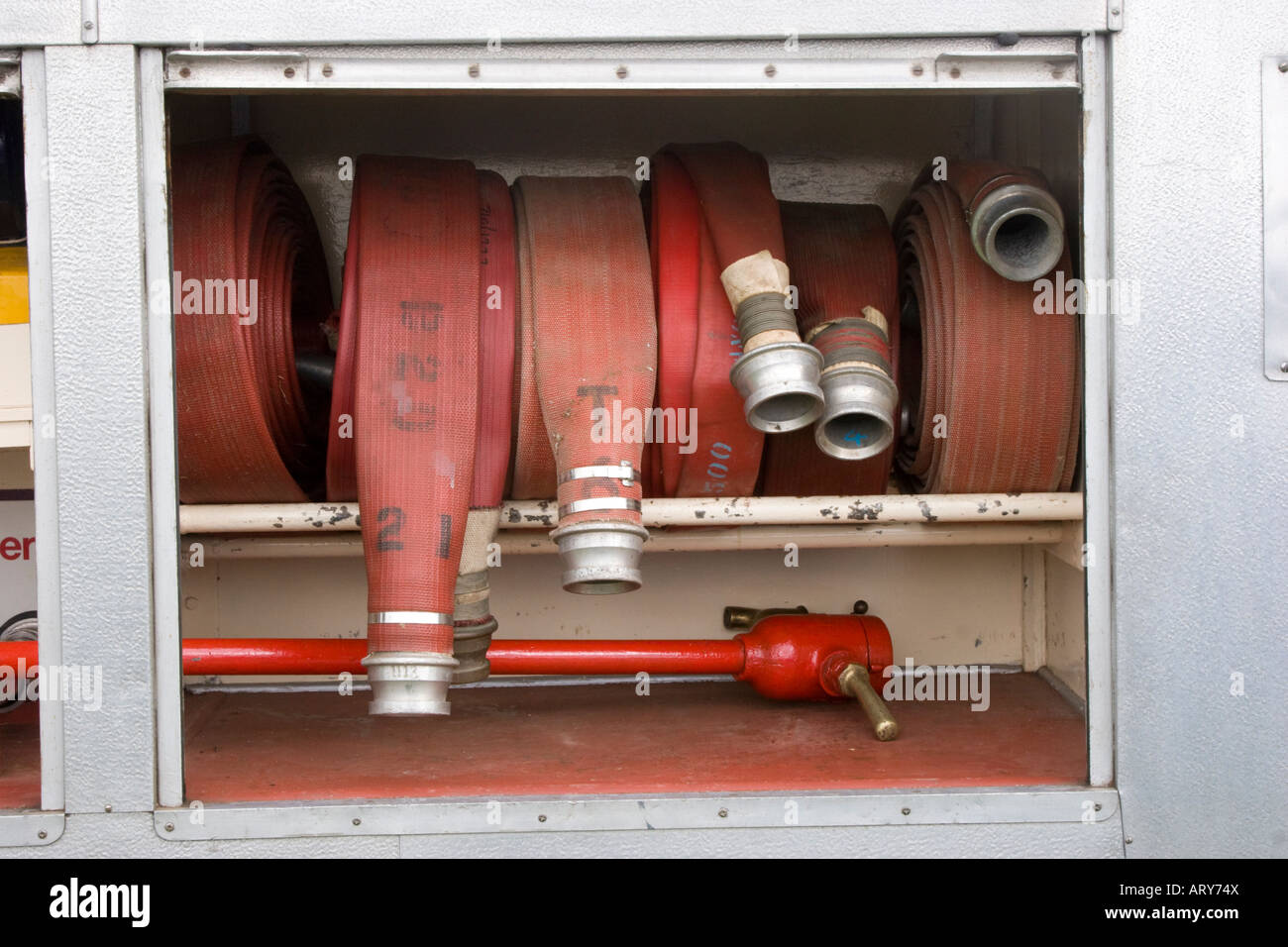 Fire-fighting hoses inside a fire engine Stock Photo - Alamy