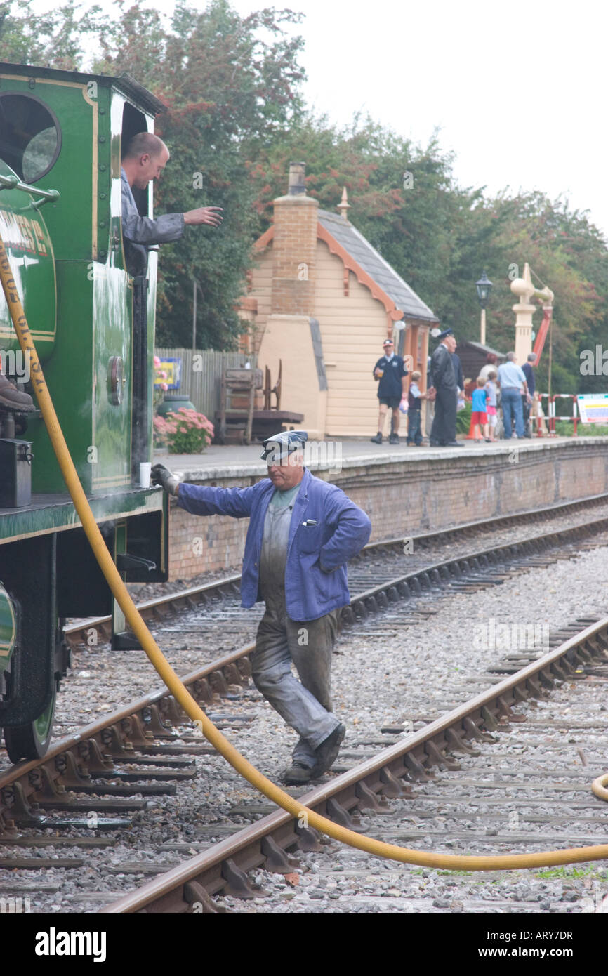 Men outside train stopped hi-res stock photography and images - Alamy