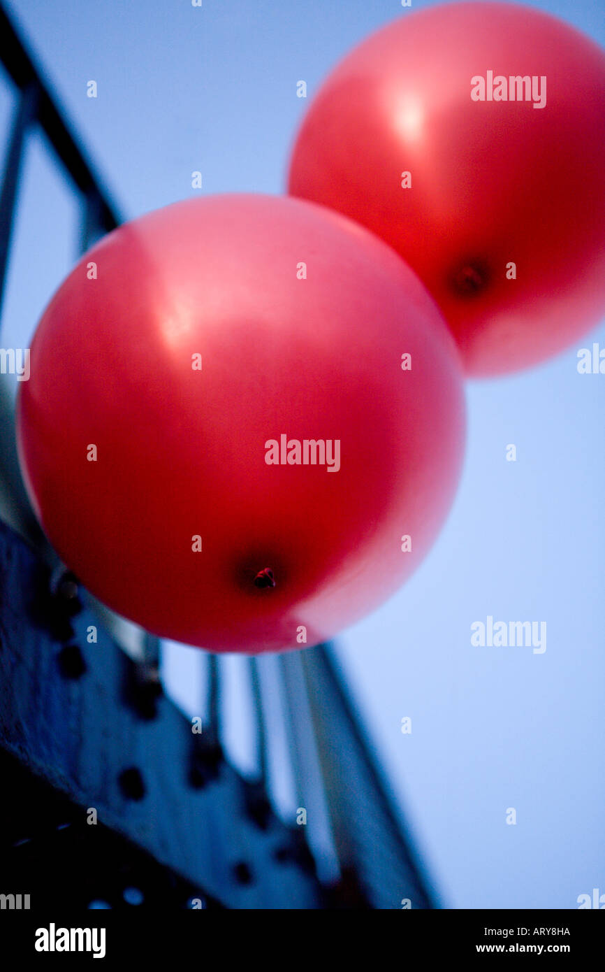 Two balloons floating off into the air Stock Photo - Alamy