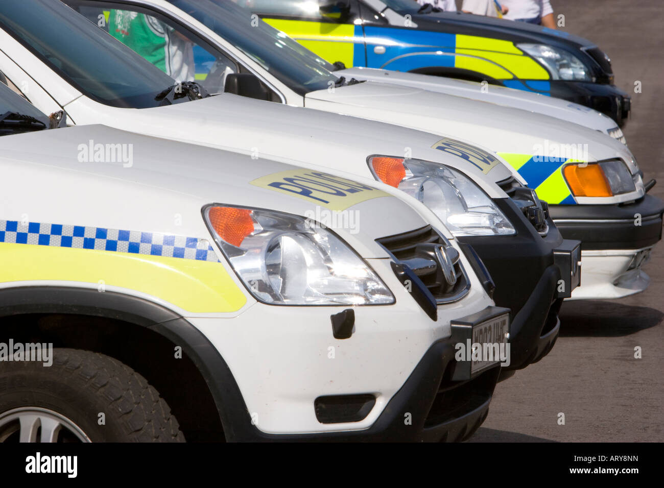 Police vehicle line up Stock Photo - Alamy