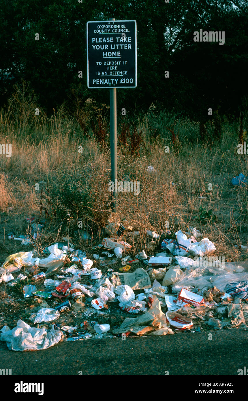 Litter dumped at roadside next to No Litter notice Oxfordshire UK Stock ...