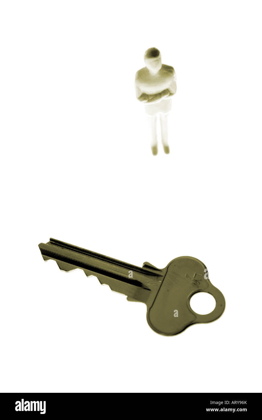 Key and business figure on white Stock Photo - Alamy