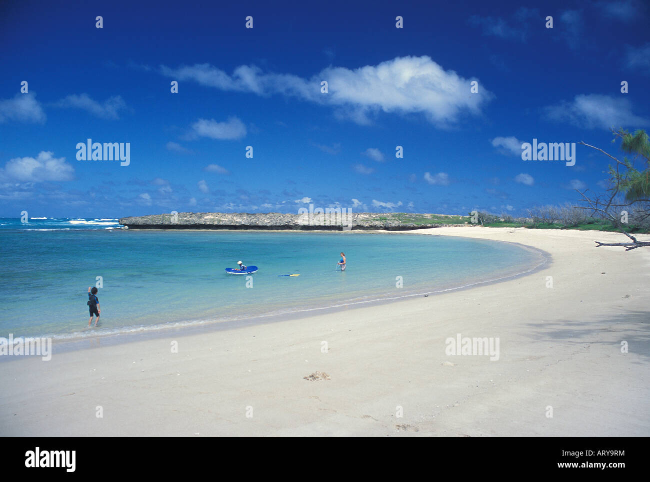 Secluded Mokuauia Beach and its clear ,placid bay and white sand are on ...
