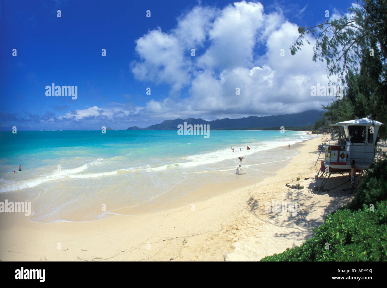 The inviting white sands and warm blue waters of Bellows Beach Park ...