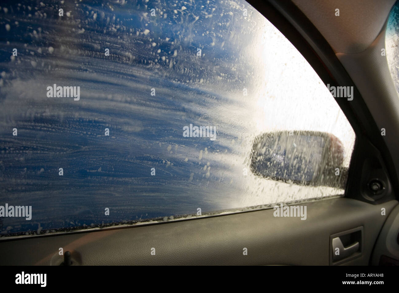 Car window covered in soap suds inside automatic carwash Vancouver ...