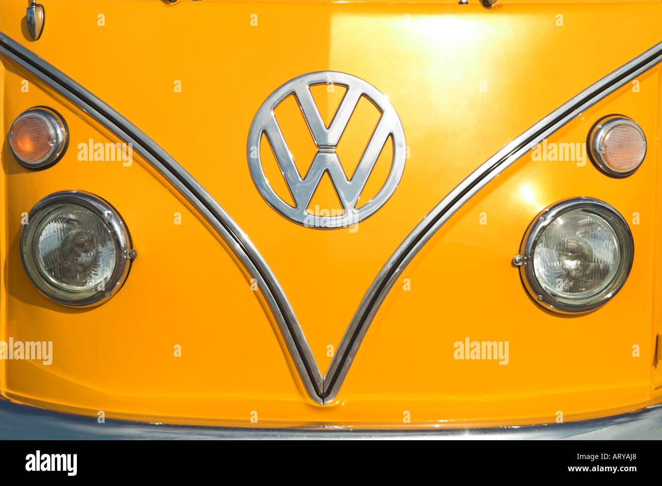 A yellow orange Volkswagen VW type 2 split camper van Stock Photo - Alamy