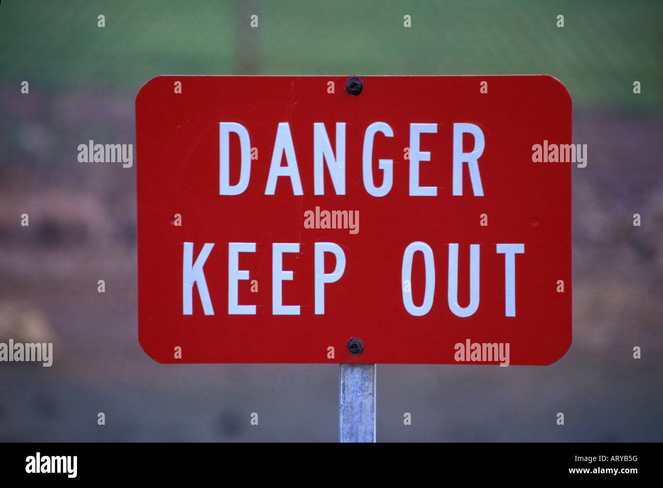 Danger Keep Out sign warns beachgoers to stay out of the water because ...