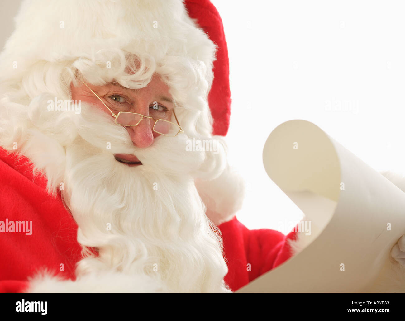 Santa checking his list Stock Photo - Alamy