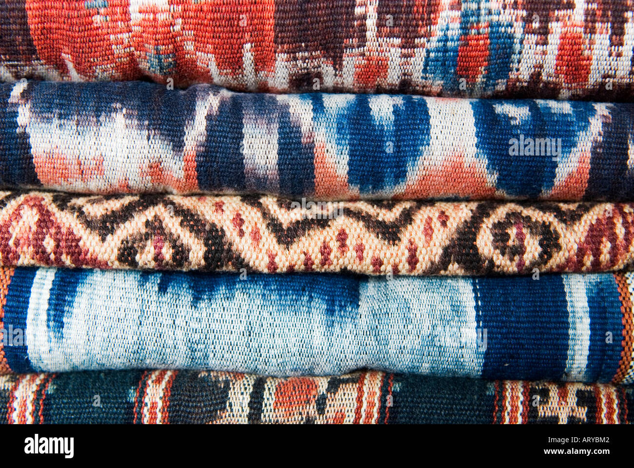 Stack of ikat textiles woven on a backstrap loom Sumba Indonesia Stock ...