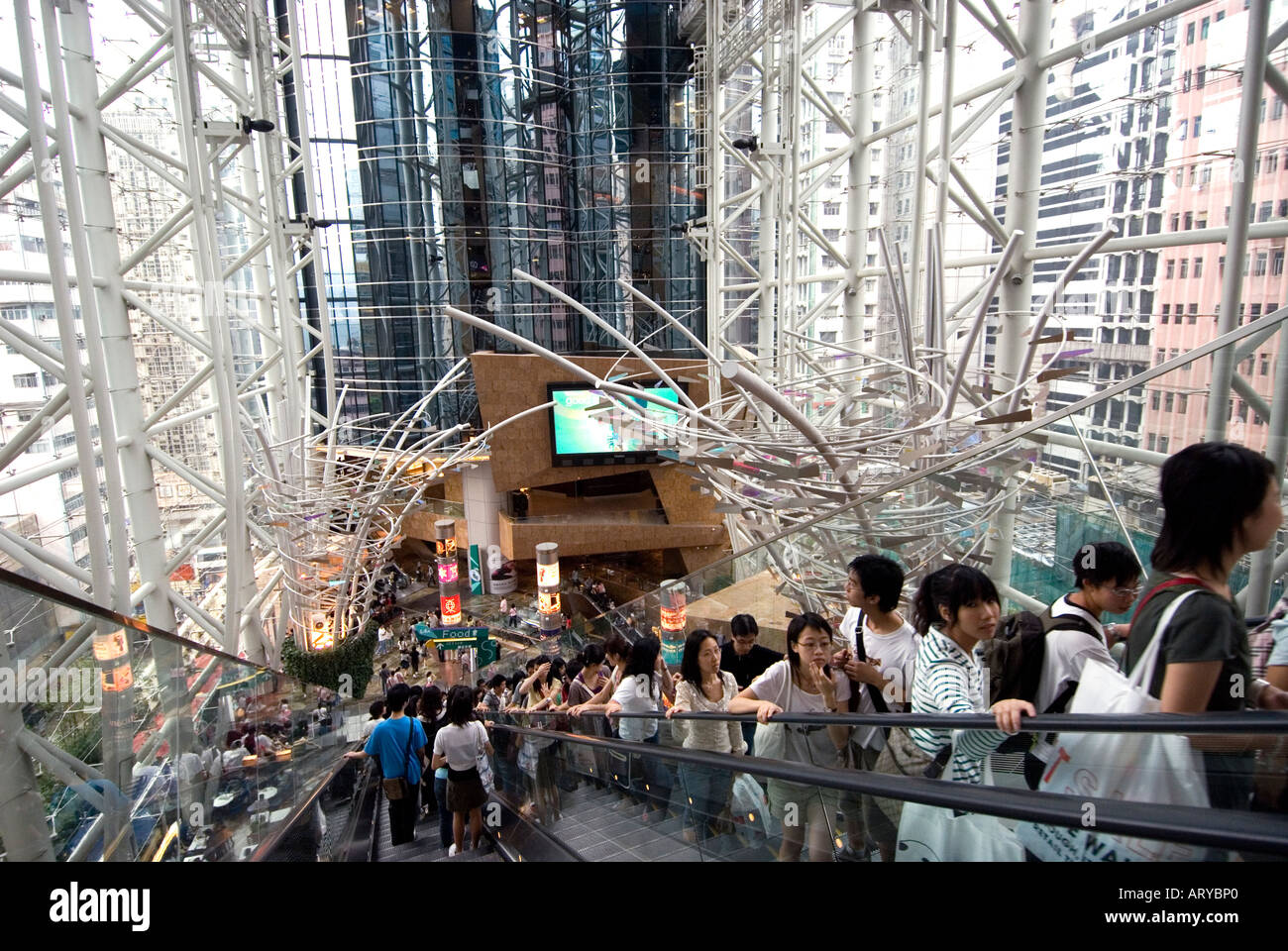 Riding down the escalator at Langham Place Mall Kowloon Hong Kong SAR ...