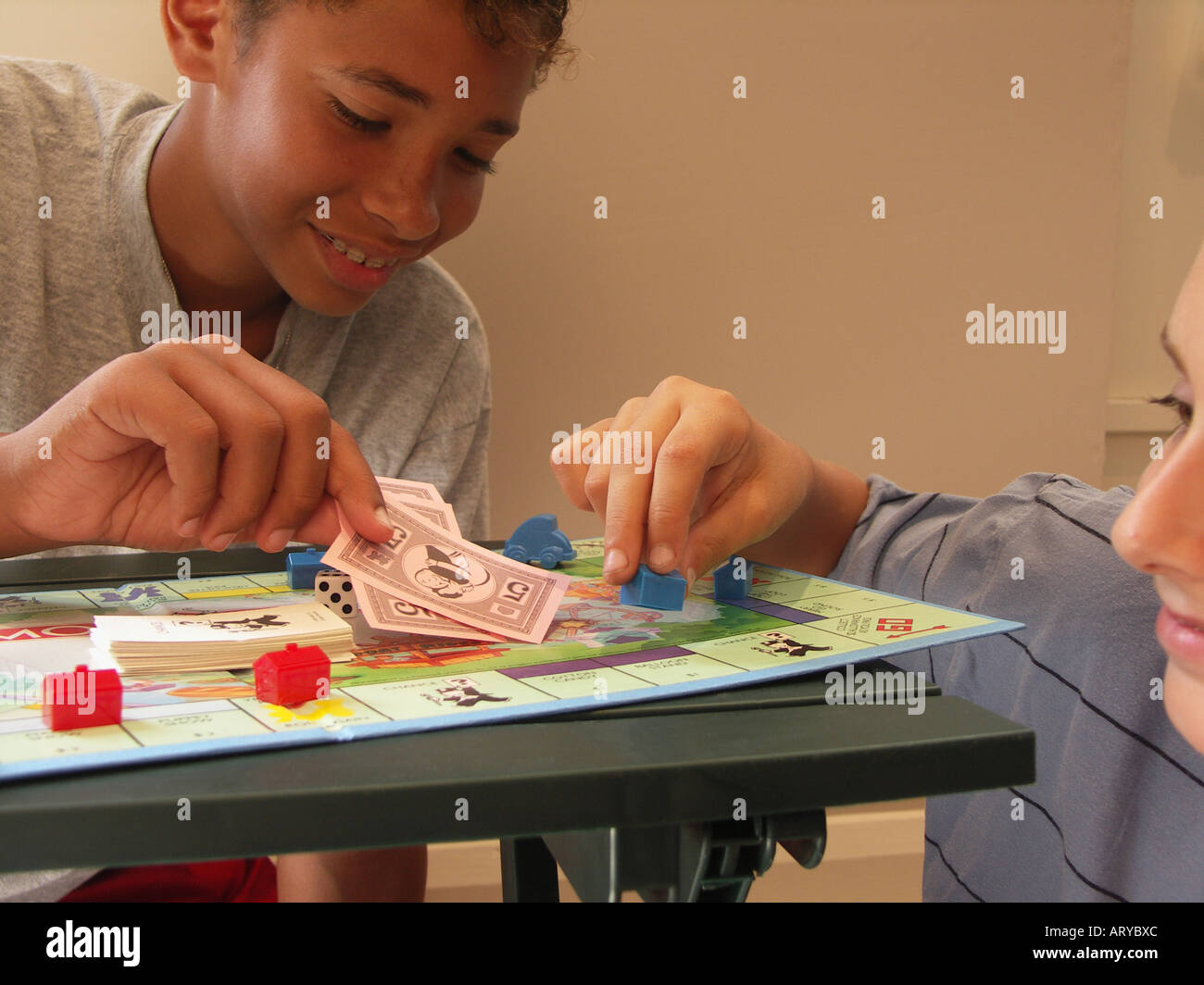 Young Boys Playing Board Game Stock Photo - Alamy