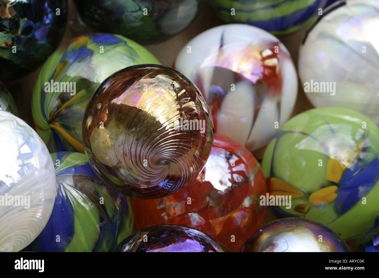 Colorful glass spheres represent the fine art of glassblowing at a ...