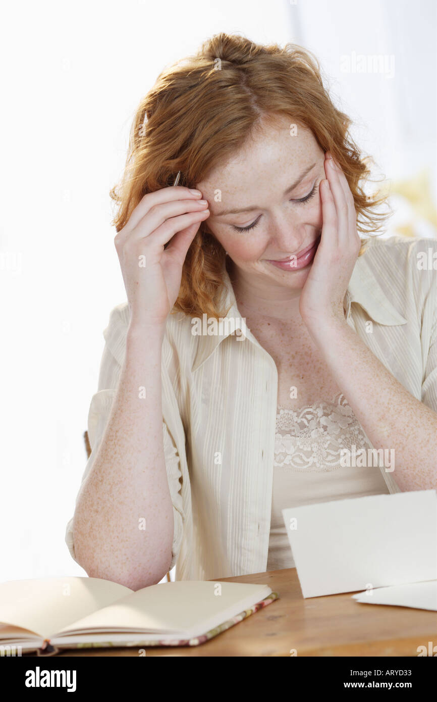 One woman table reading letters hi-res stock photography and images - Alamy