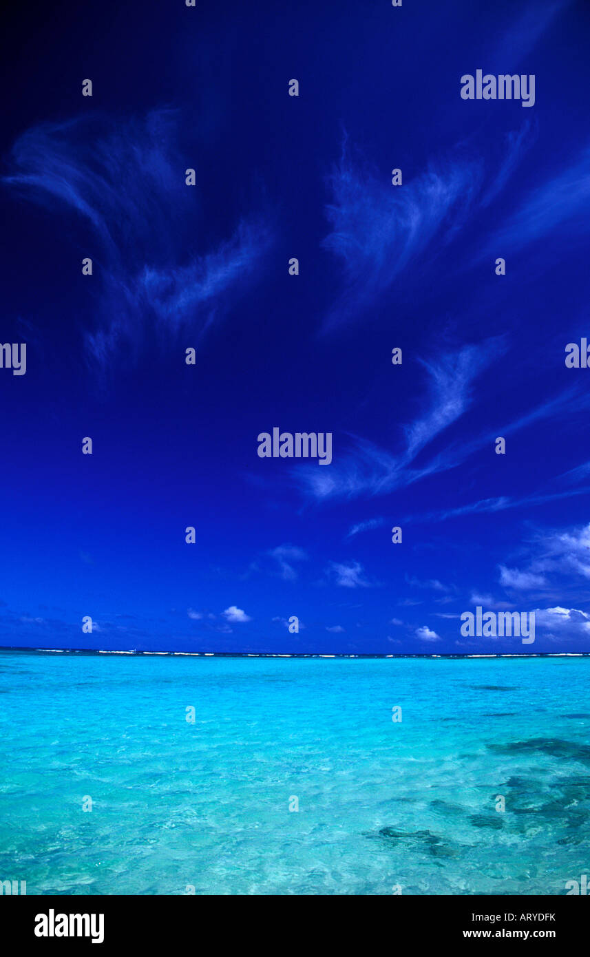 Deep blue sky, whispy clouds and turquois blue ocean water. Photo taken ...