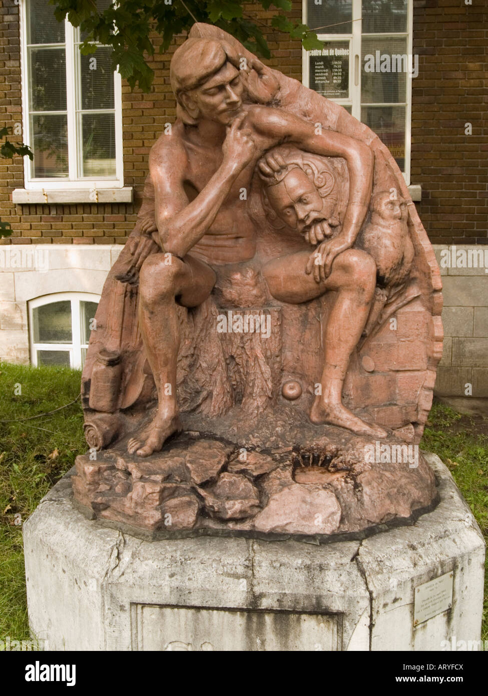 A statue of two men on Rue Saint Jean in Quebec City, Canada Stock ...