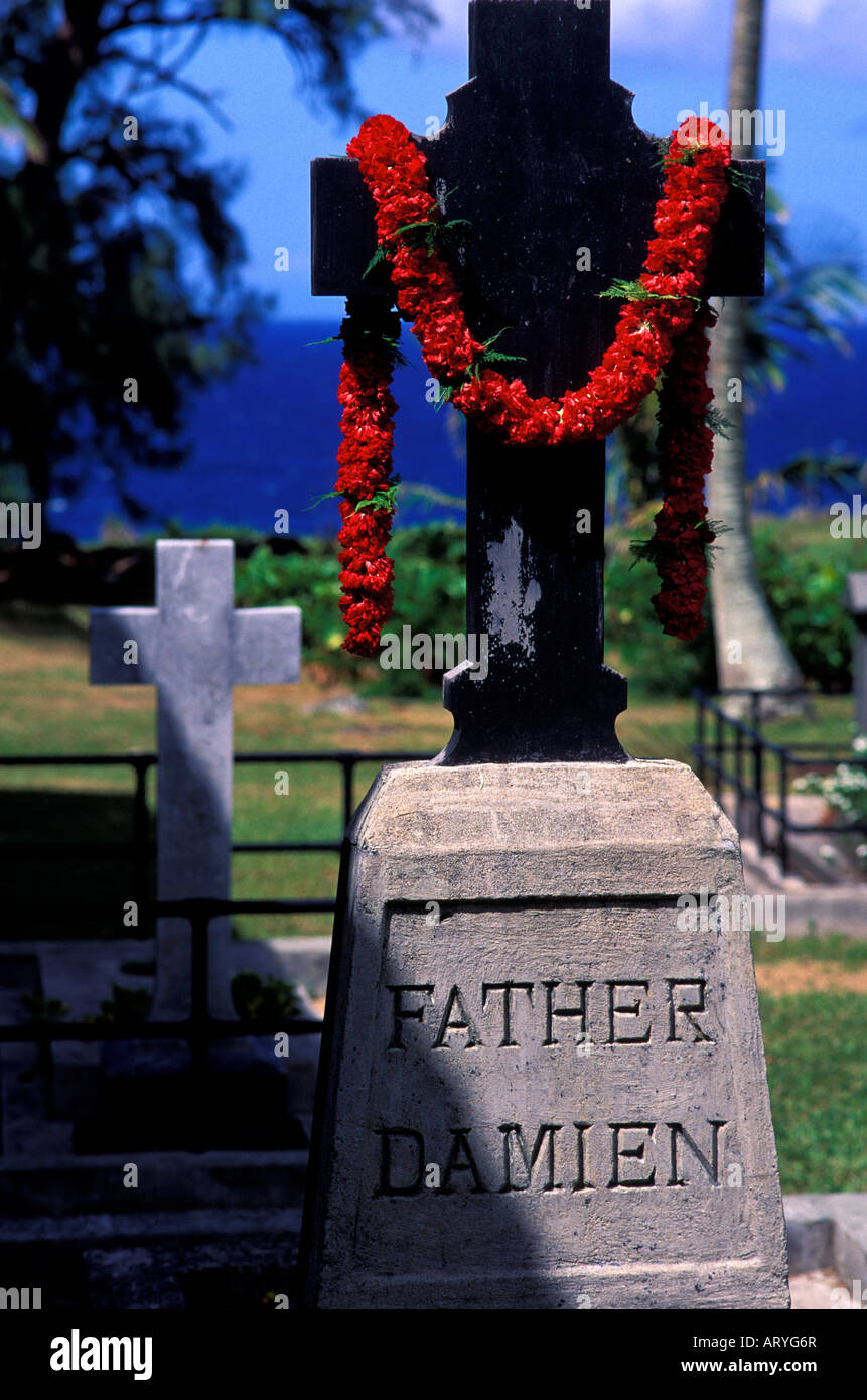 Father Damien's headstone draped with lei, located outside St ...