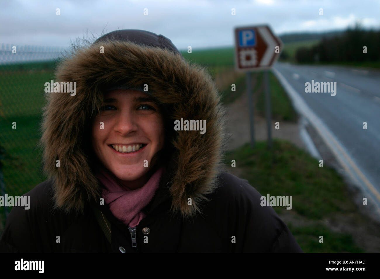 Woman on side of road Stock Photo - Alamy