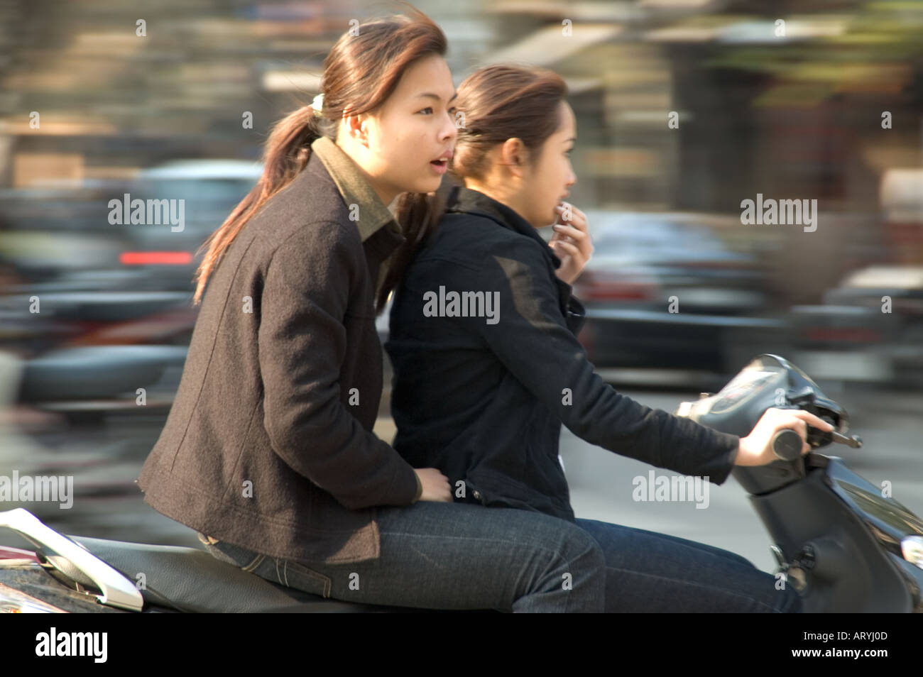 Two girls in a crowded street in Hanoi Vietnam Stock Photo - Alamy