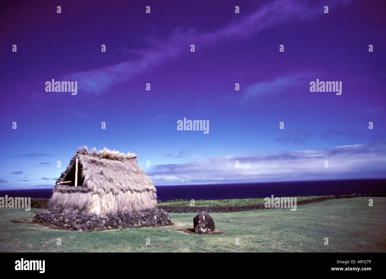 Hale (thatched Hawaiian hut) at the Mookini Heiau, along the North ...