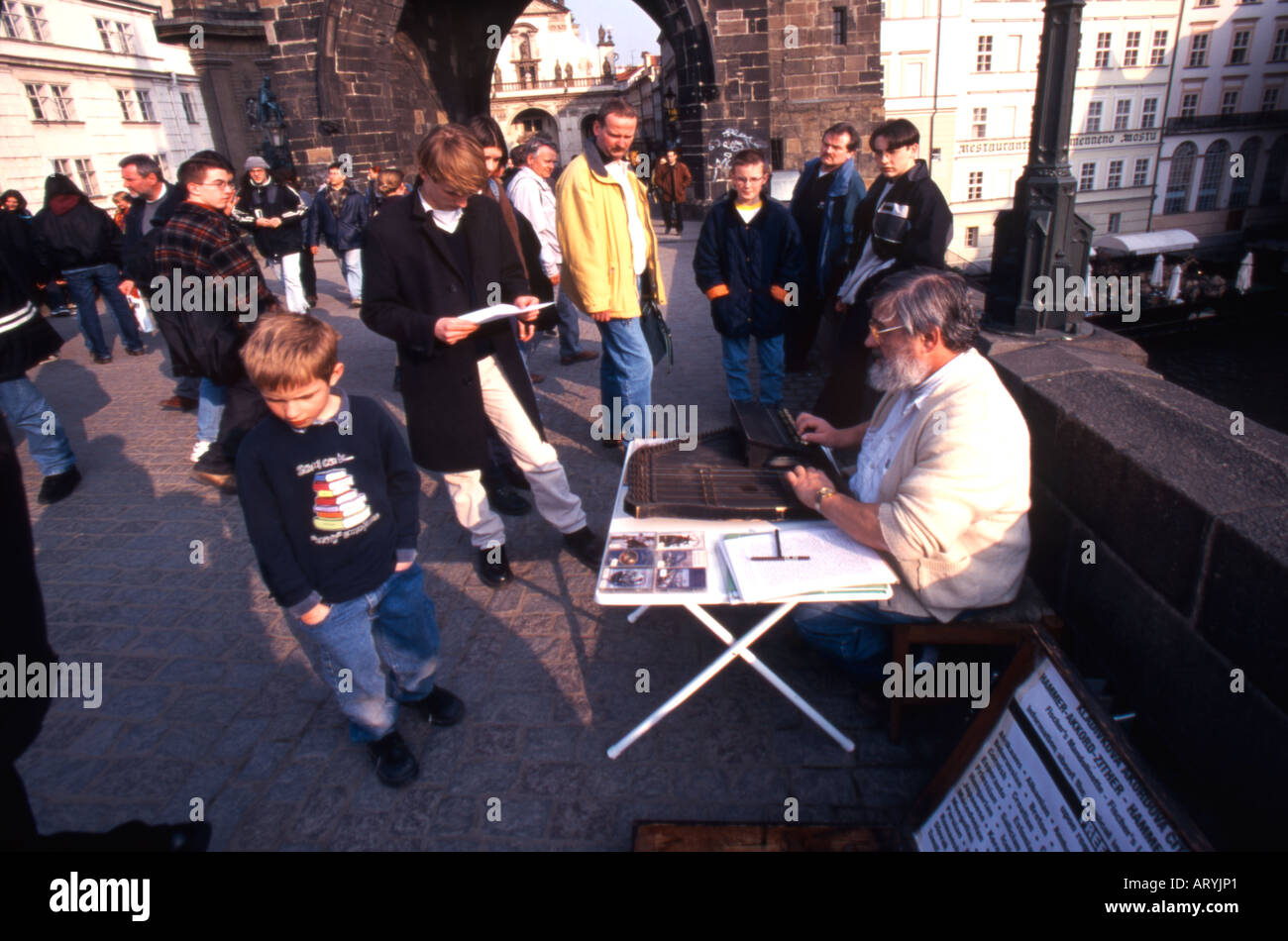 Musician playing a musical instrument on Charles Bridge Prague Czech ...