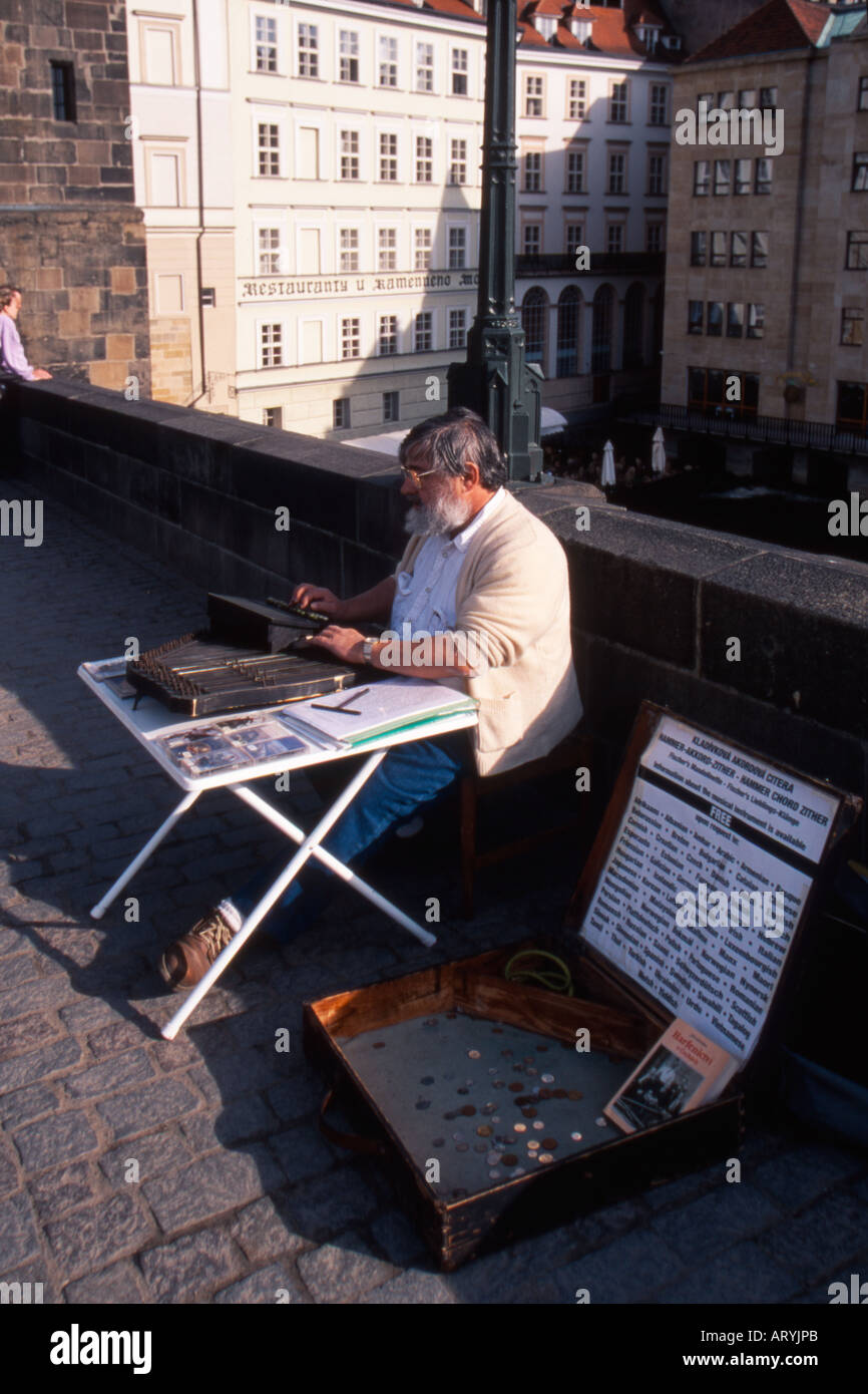 Musician playing a musical instrument on Charles Bridge Prague Czech ...
