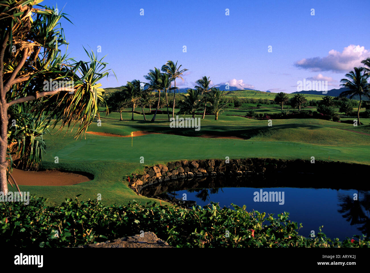 Poipu Bay golf course hole #18, island of Kauai Stock Photo - Alamy