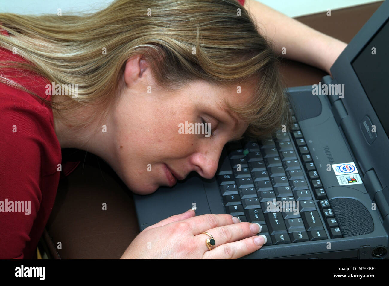 Woman sleeping on keyboard laptop hi-res stock photography and images ...