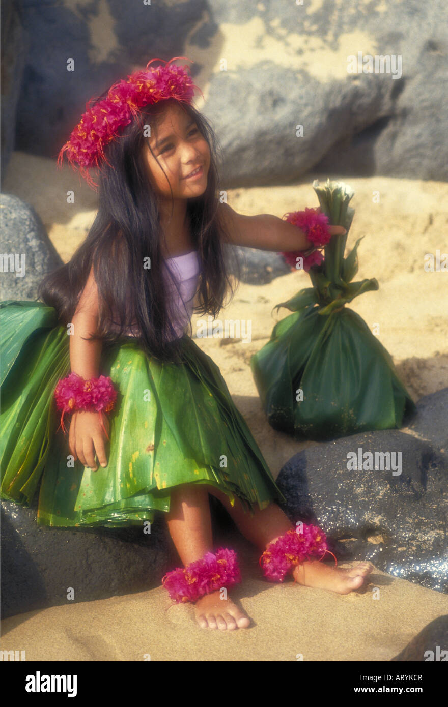 Keiki (child) hula dancer with ti leaf offering Stock Photo - Alamy