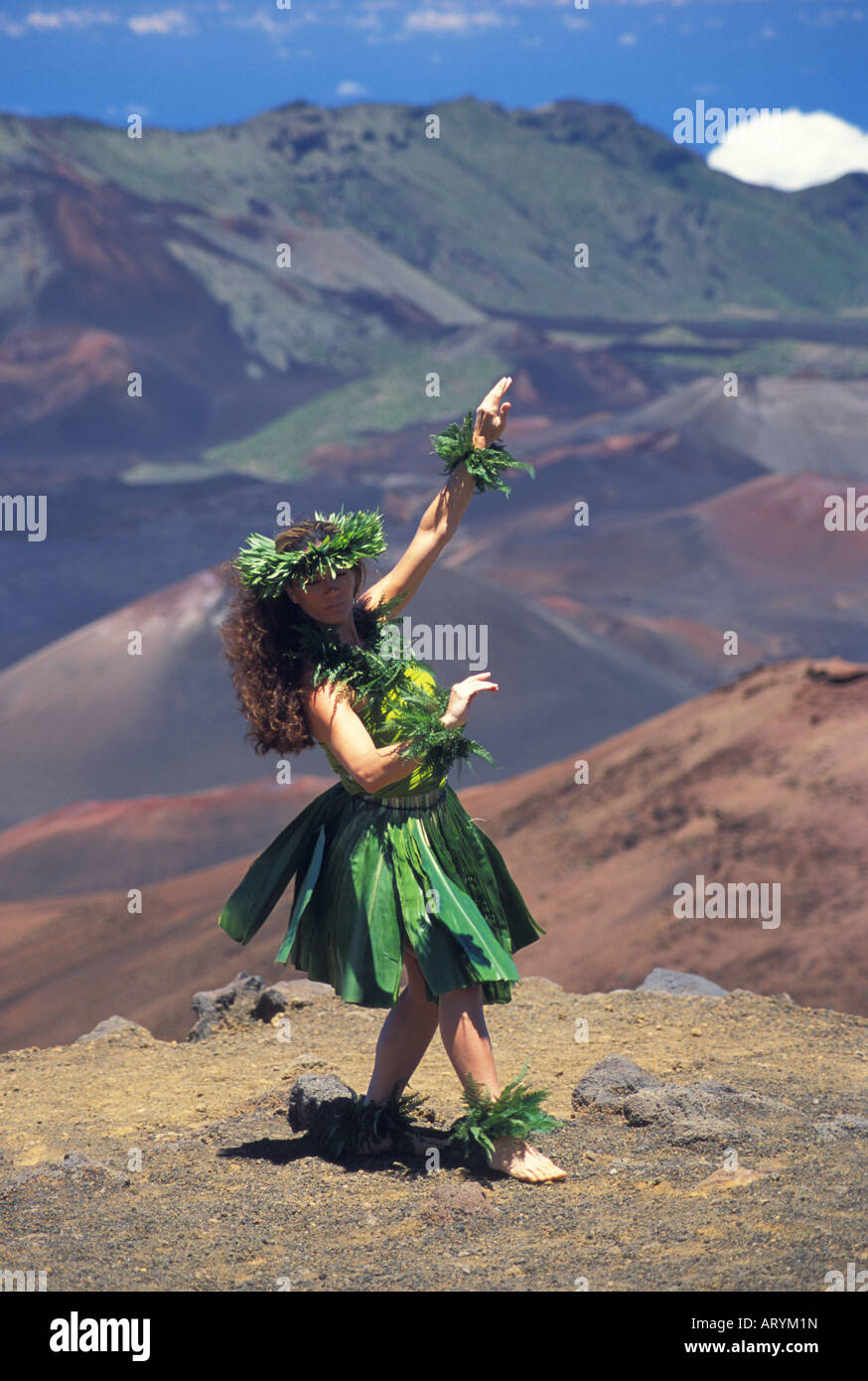 Native woman dancing hula with ipu (gourd) at Haleakala crater, island ...