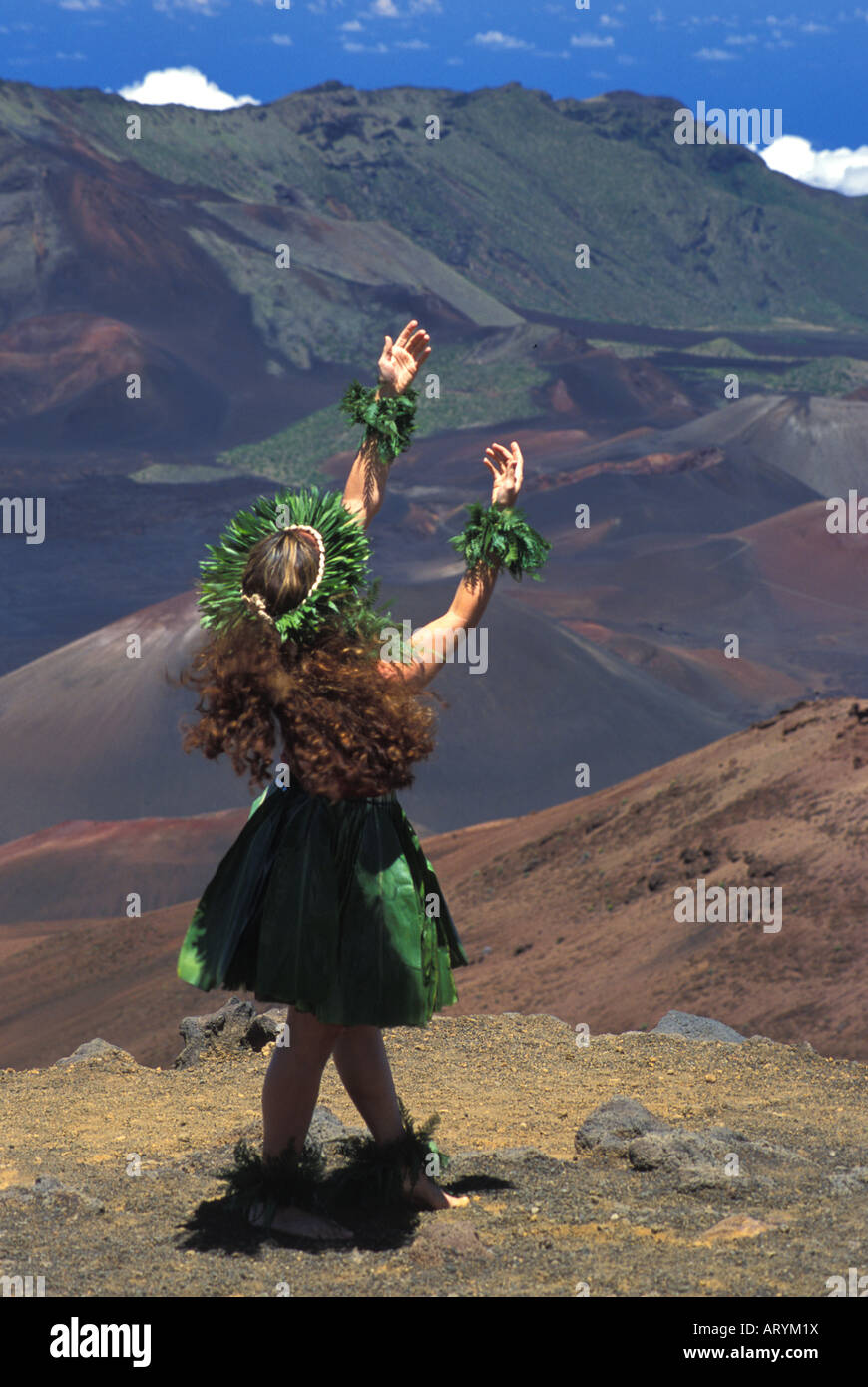 Native woman dancing hula with ipu (gourd) at Haleakala crater, island ...