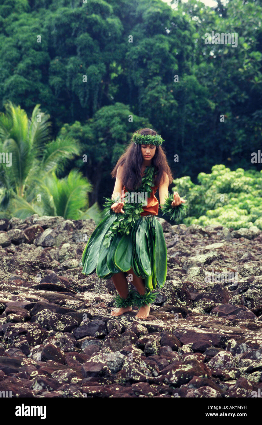Young hula dancer in ti leaf skirt at Hawaiian heiau ( temple site ...