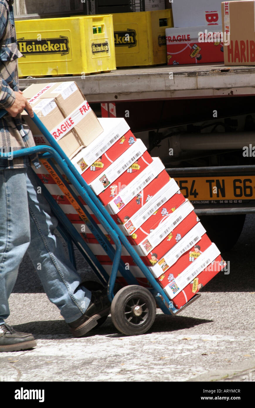 sack barrow sackbarrow trolley unloading unload Stock Photo - Alamy