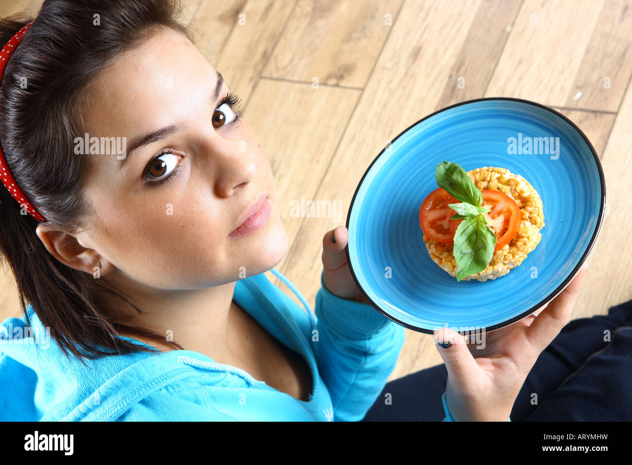 Teenage Girl Eating Rice Cakes Stock Photo - Alamy