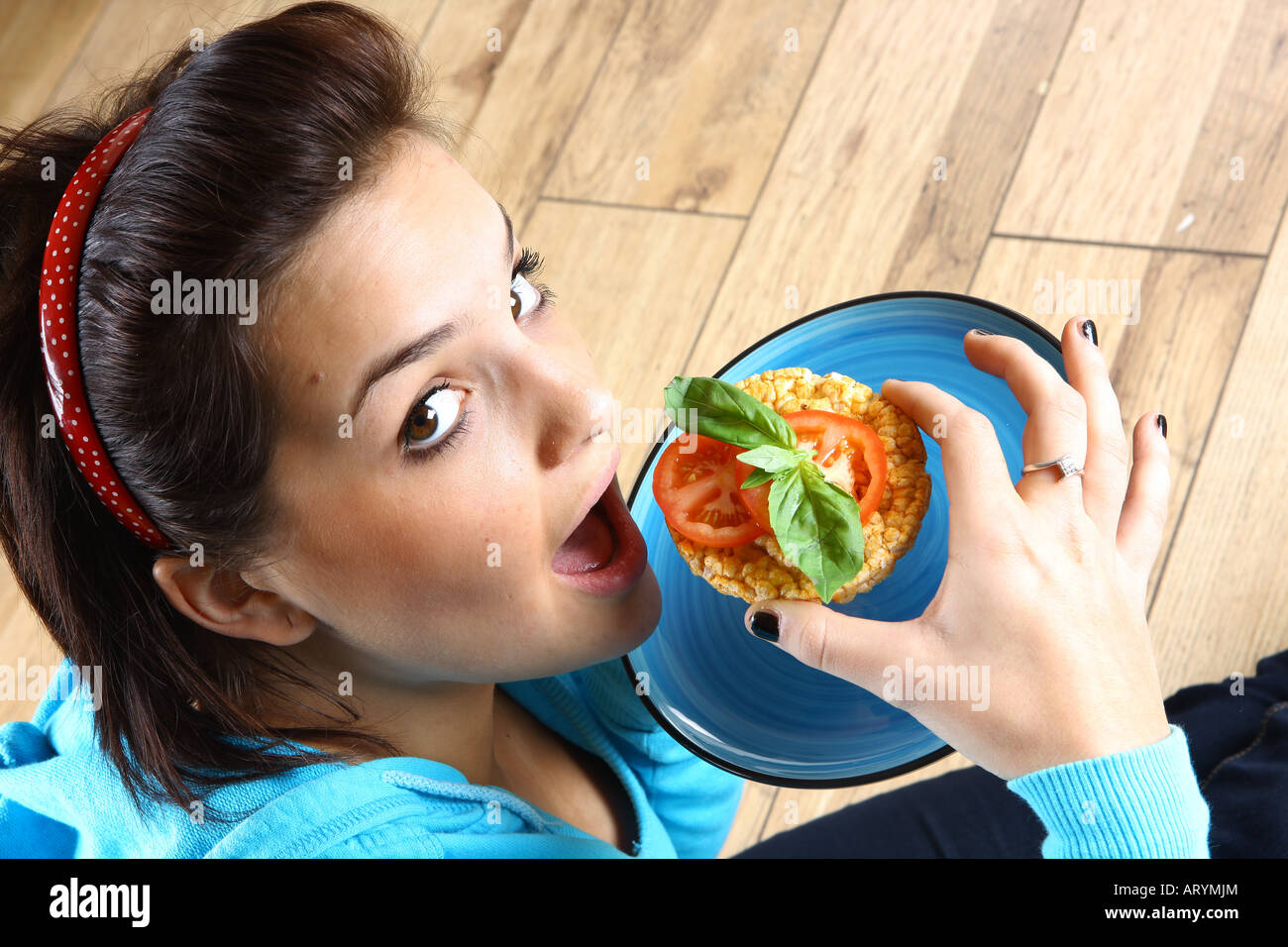 Teenage Girl Eating Rice Cakes Stock Photo - Alamy