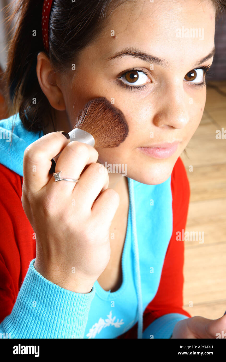 Teenage Girl Applying Face Powder Stock Photo - Alamy