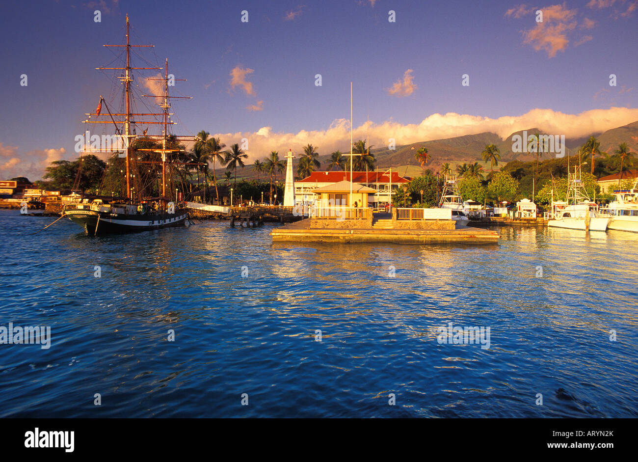 Lahaina Harbor at sunset. West Maui Mountains in the background, with ...