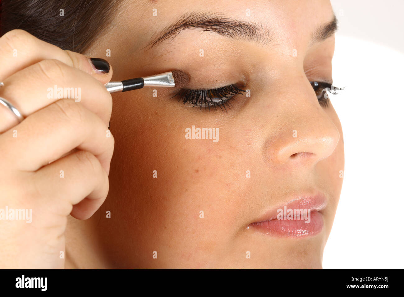 Teenage Girl Applying Eye Shadow Stock Photo - Alamy