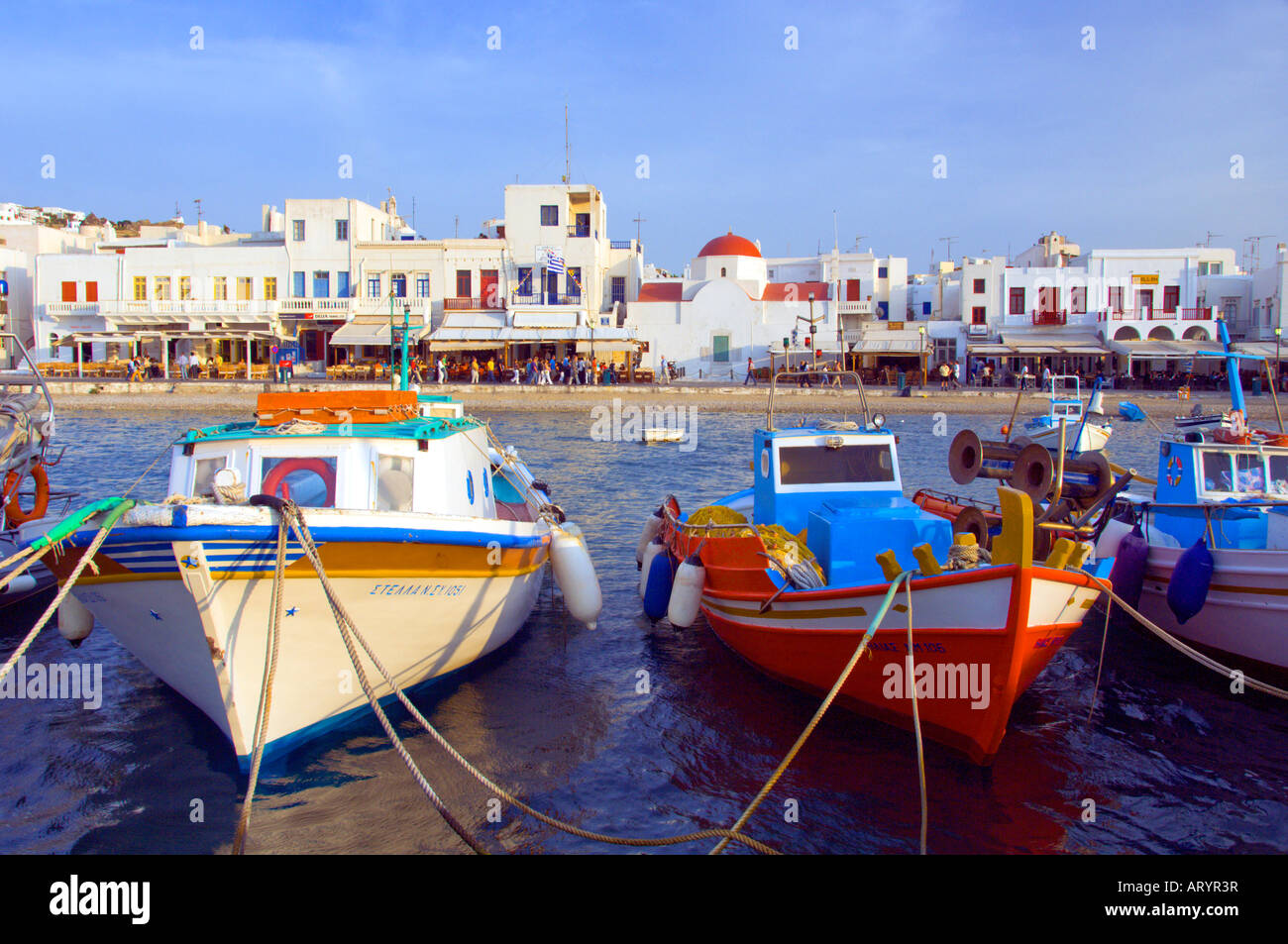 The port of Hora with colorful fishing boats on the Greek Island of ...