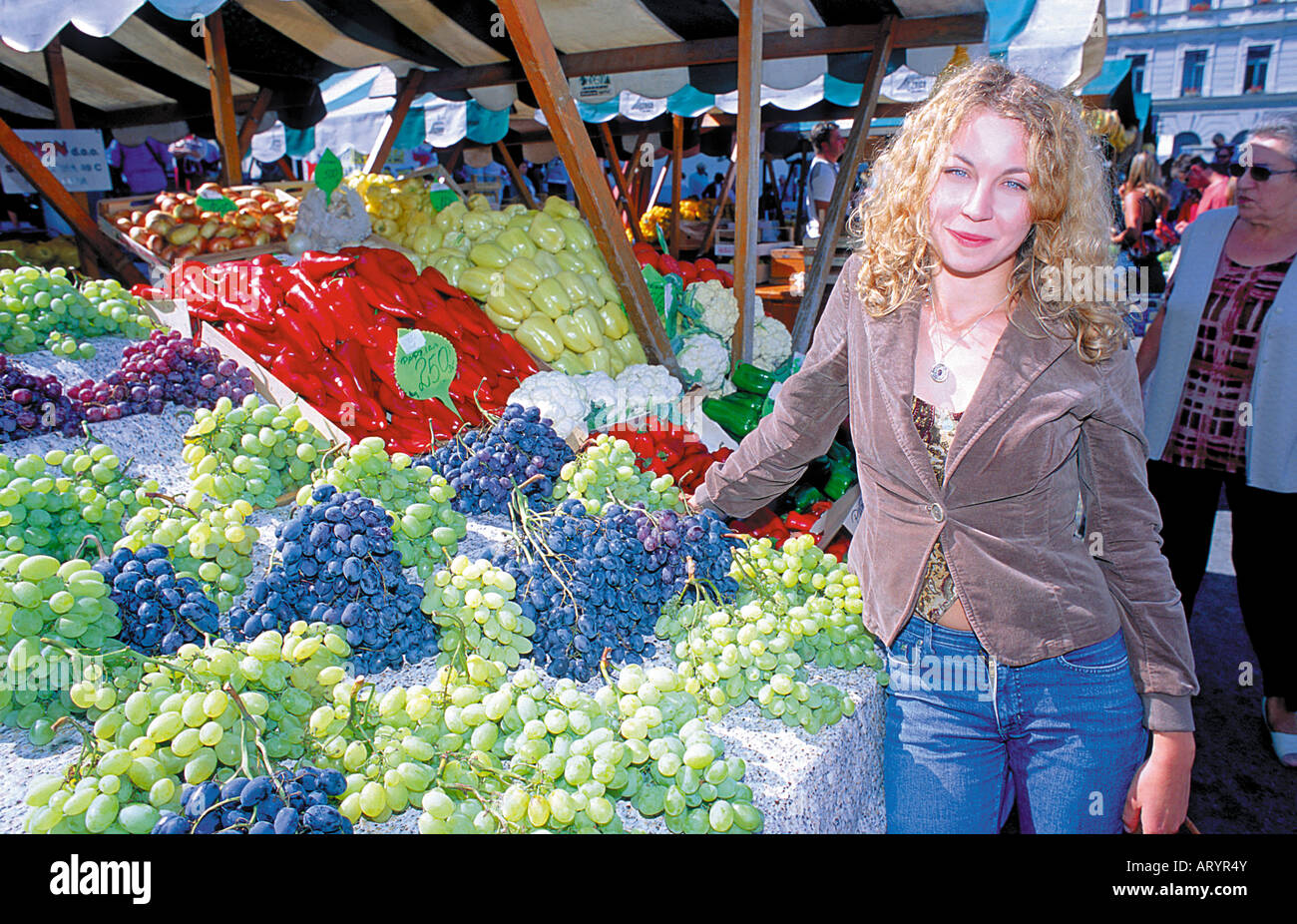 Slovenian artist Jasna Radonai at a fruit stand on the market of ...