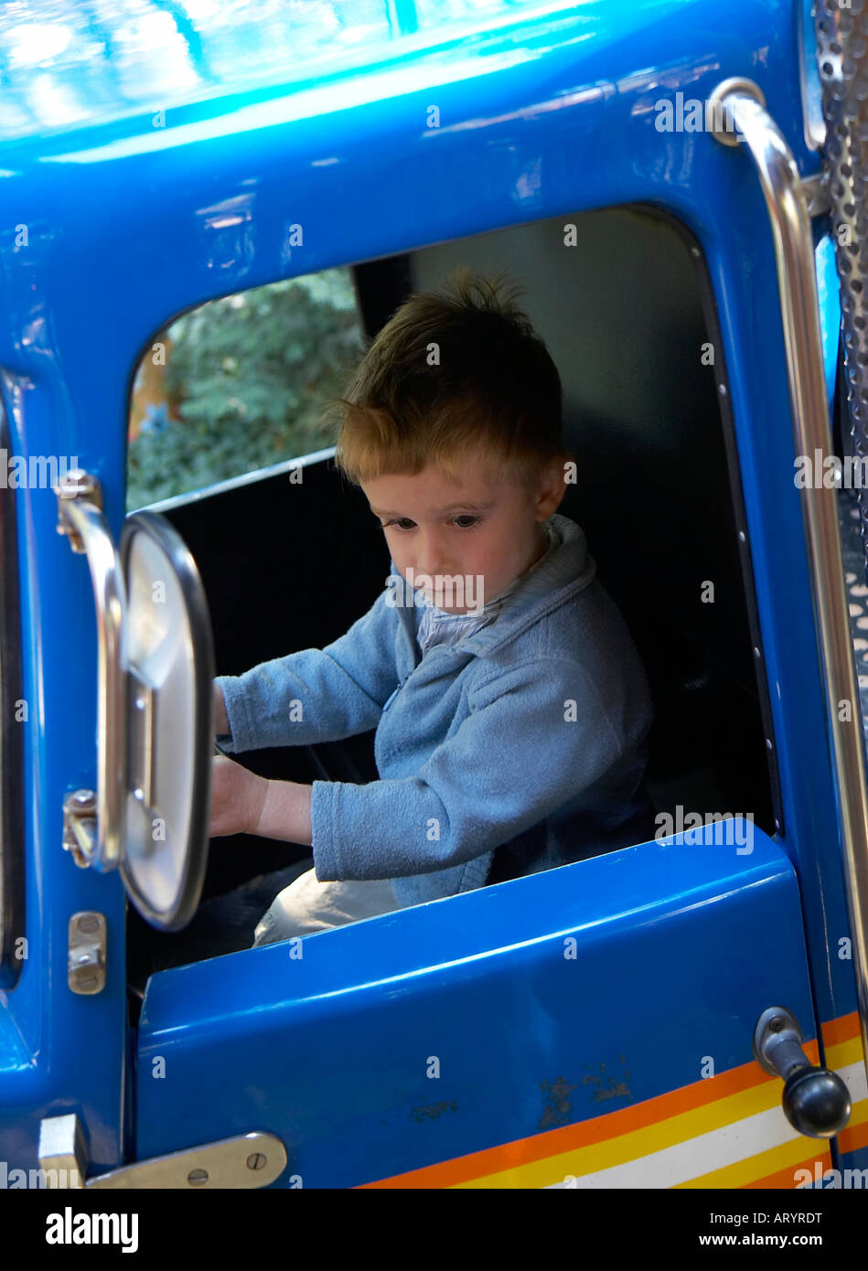 little boy driving with tractor Stock Photo - Alamy