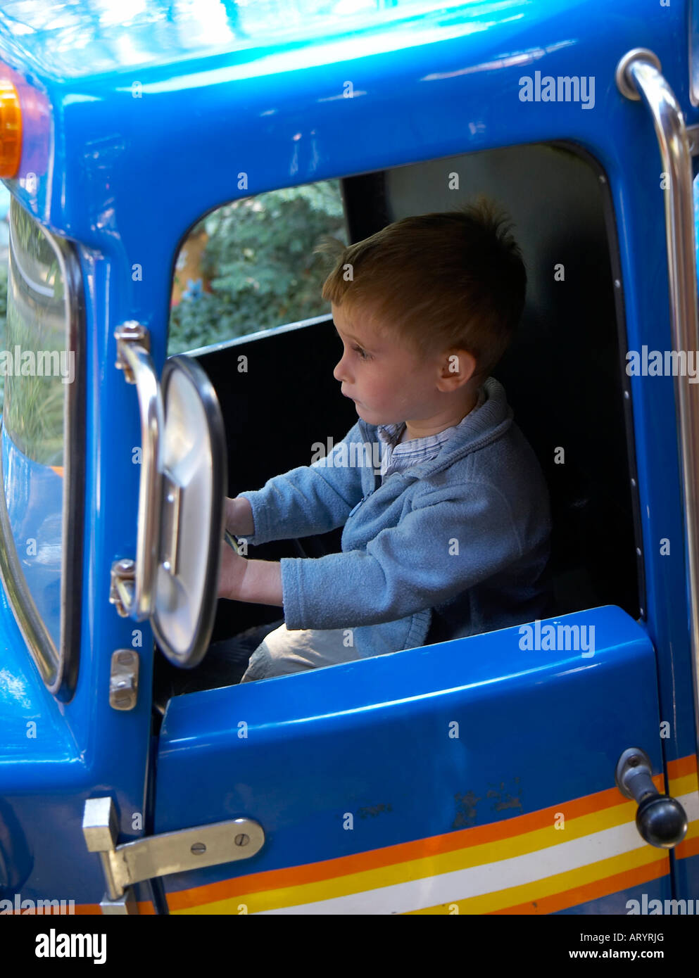 little boy driving with tractor Stock Photo - Alamy