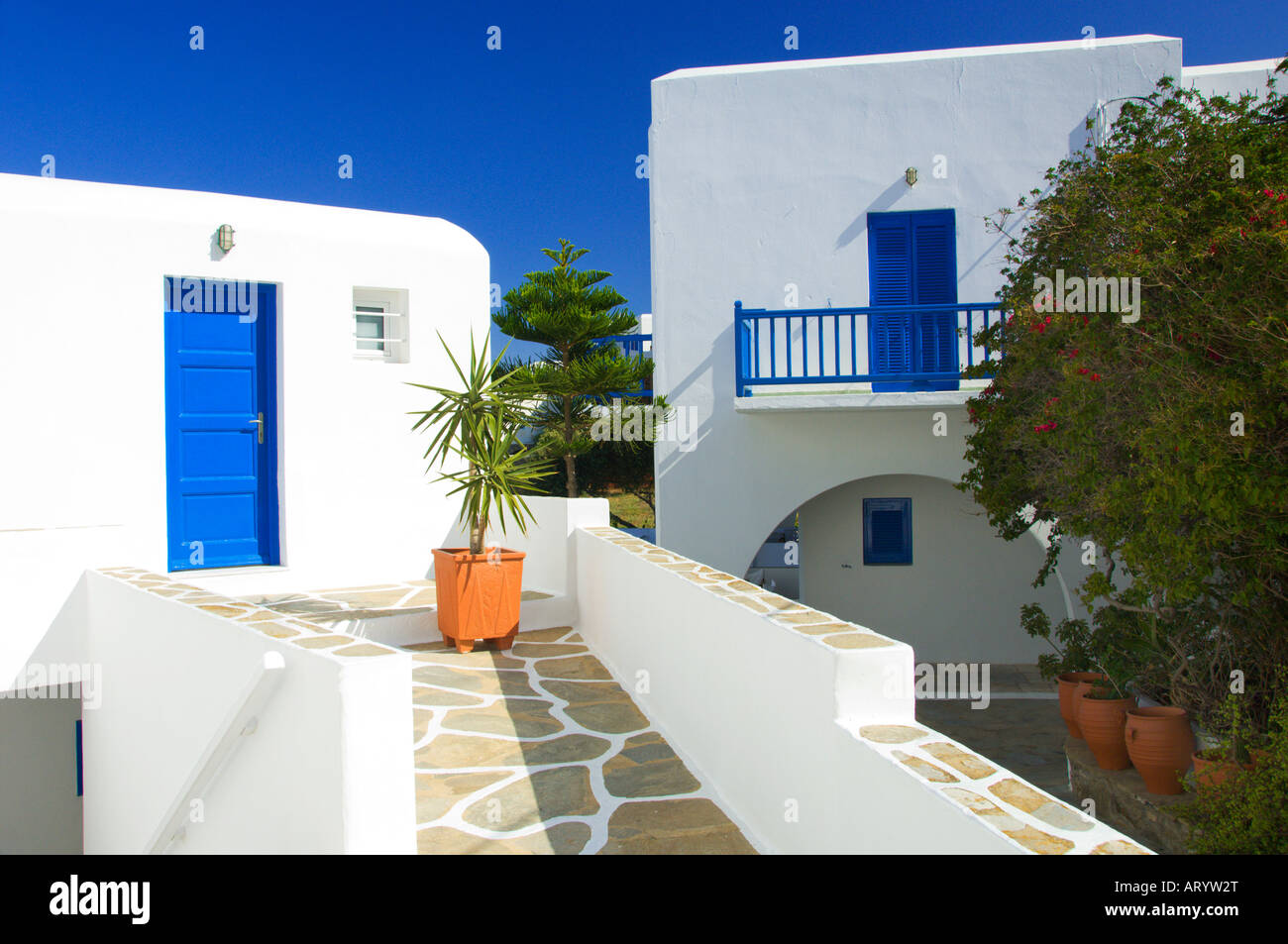 Greek architecture featuring blue doors and whitewashed walls in Hora ...