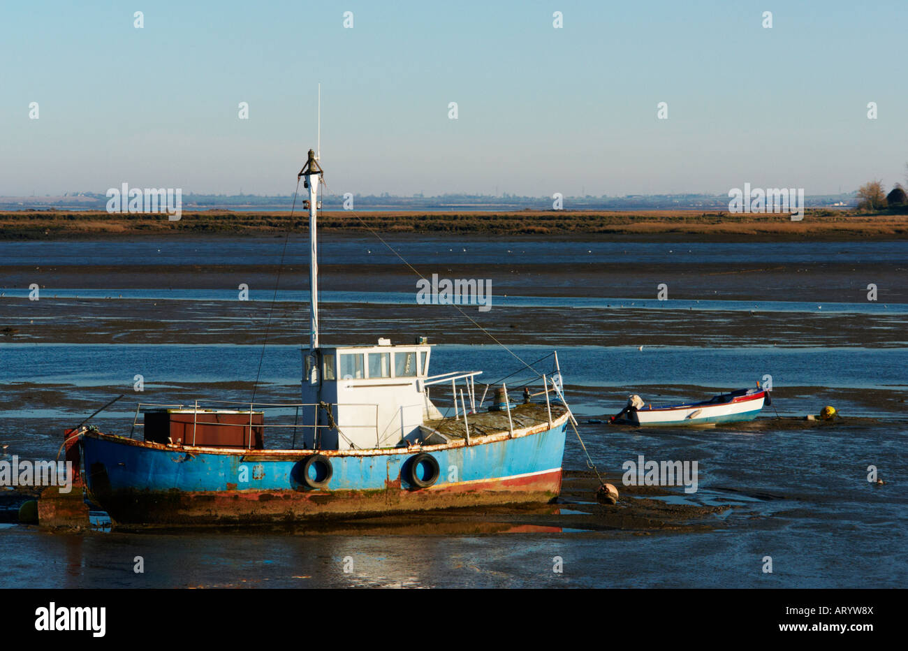Boat on the tidal River Blackwater at Heybridge Basin Essex England ...