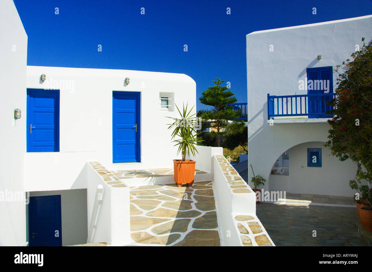Greek architecture featuring blue doors and whitewashed walls in Hora ...