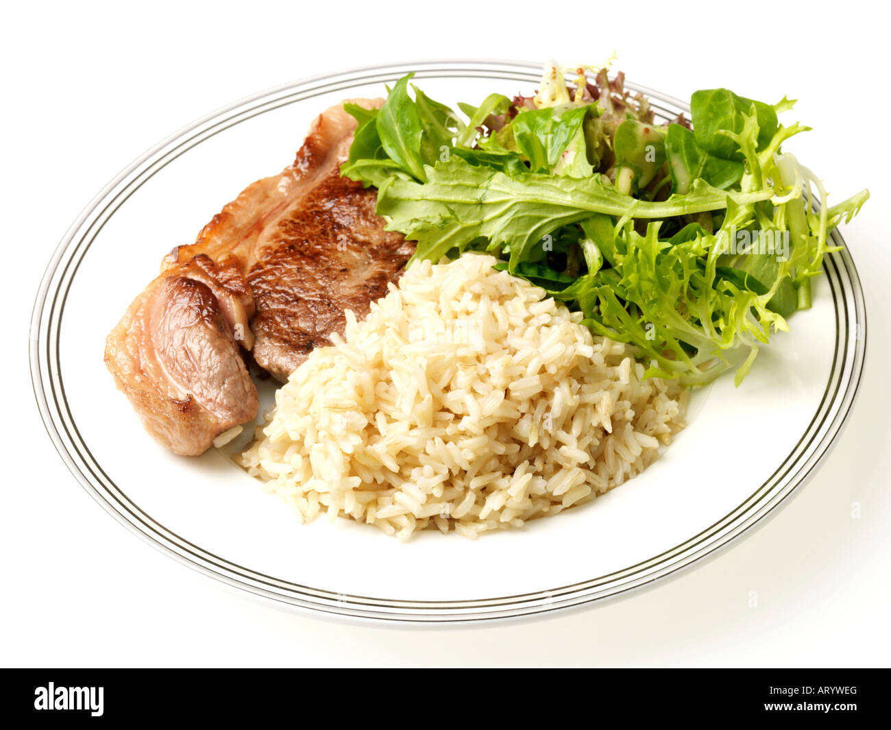 Fresh Lean Rump Beef Steak With Brown Rice and Salad Isolated Against A ...