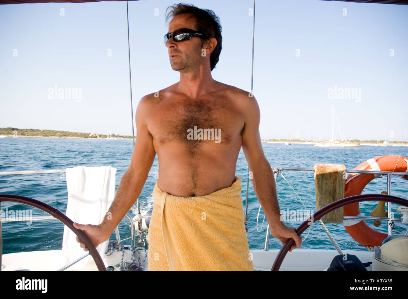 Man posing as a sea captain Stock Photo - Alamy